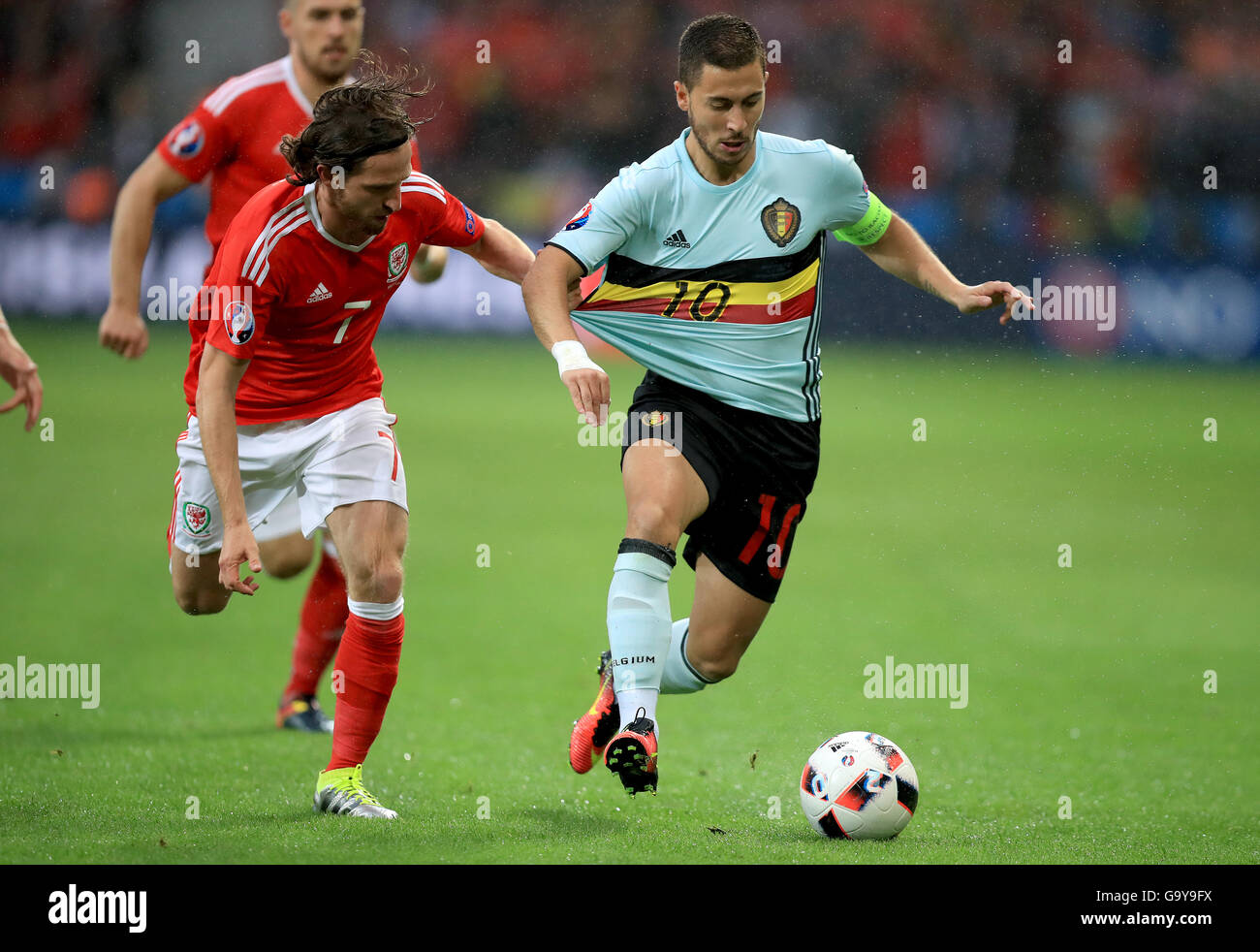 Wales' Joe Allen (left) and Belgium's Eden Hazard (right) battle for ...