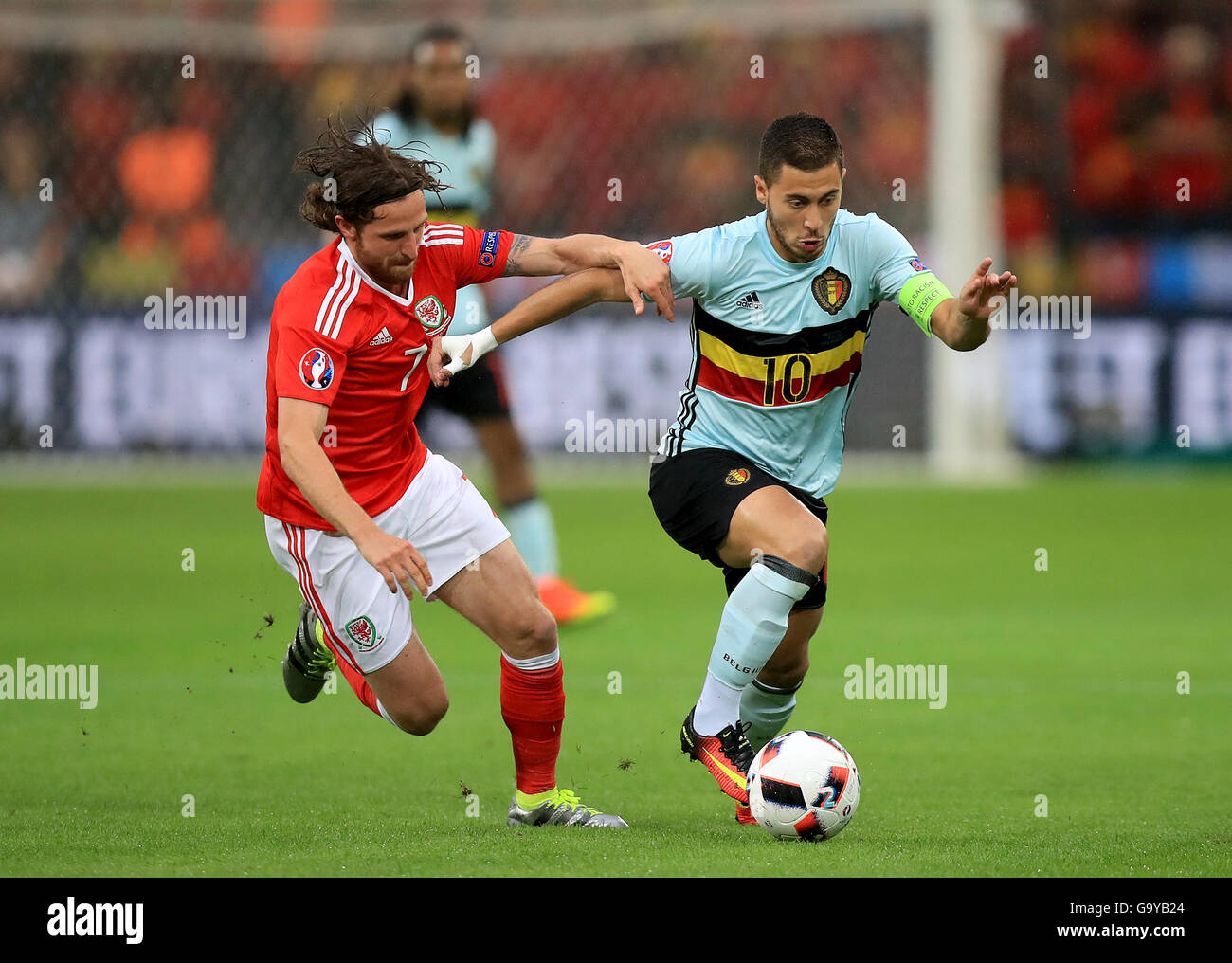 Wales' Joe Allen (left) and Belgium's Eden Hazard (right) battle for ...