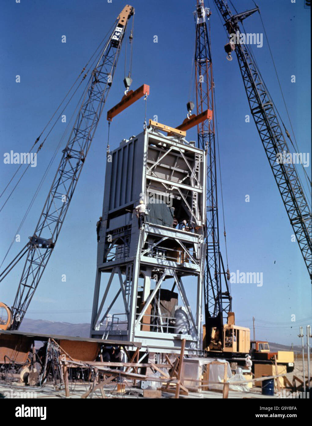 The Atlas missile launches during a test, with the rocket plume visible ...