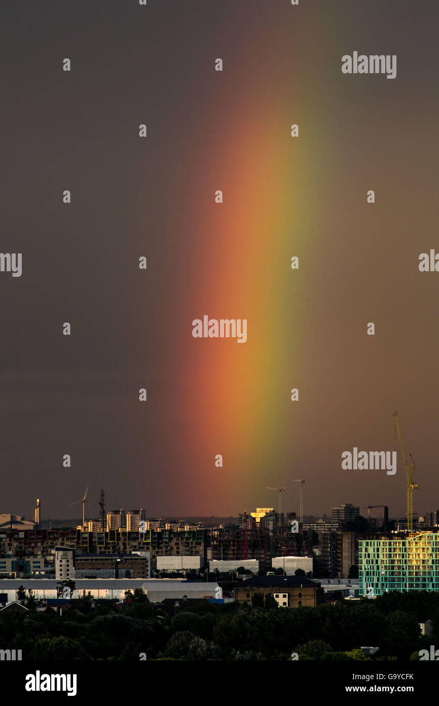 London, UK. 1st July, 2016. UK Weather: Colourful rainbow breaks during ...