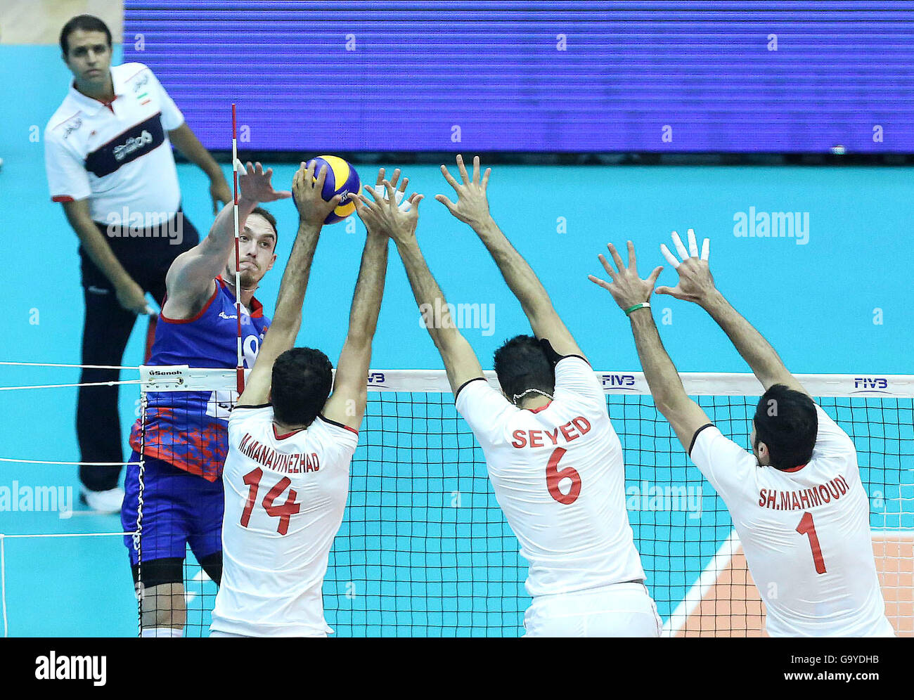 Tehran, Iran. 1st July, 2016. Marko Ivovic (L) of Serbia spikes the ...