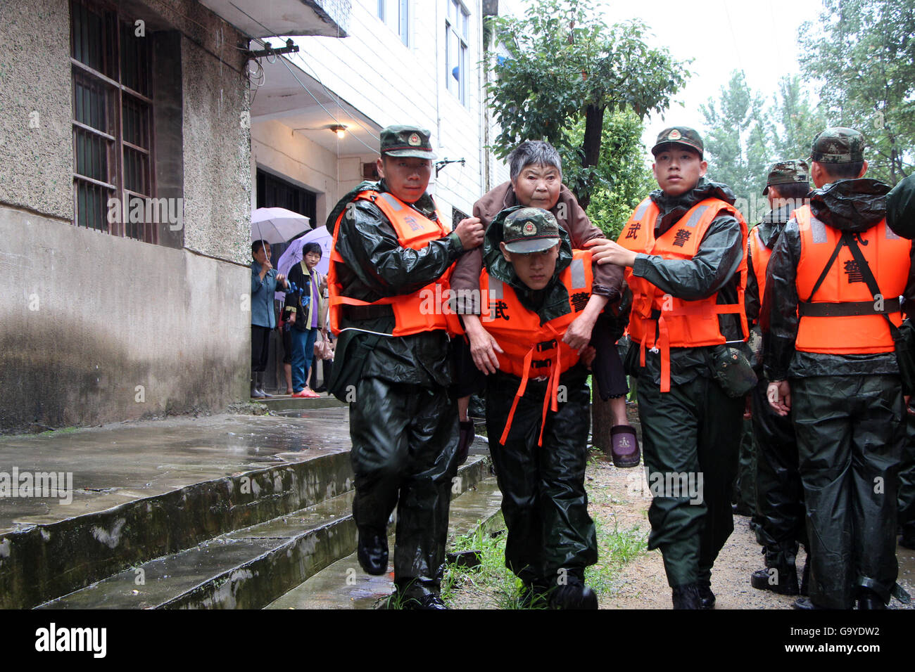 Anqing, China's Anhui Province. 2nd July, 2016. Rescuers evacuate a ...
