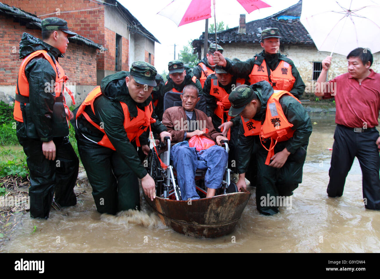 Anqing, China's Anhui Province. 2nd July, 2016. Rescuers evacuate a ...