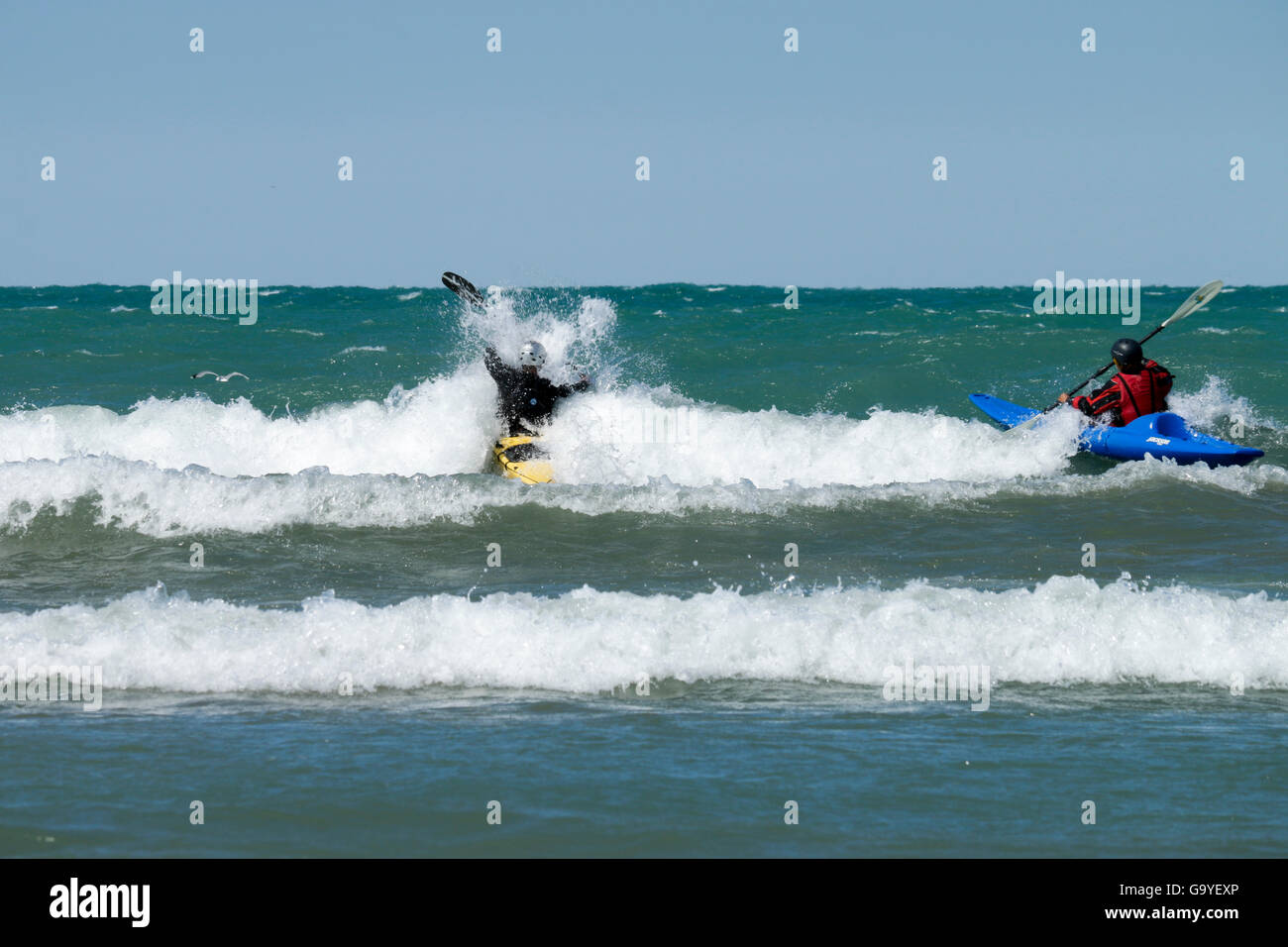Chicago, USA. 1st July 2016. Kayakers paddle out through the surf at ...