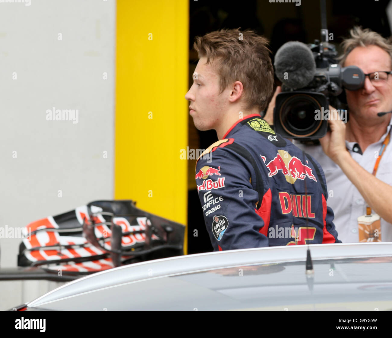 Red Bull Racing driver Daniil Kvyat of Russia is returned to his pit ...