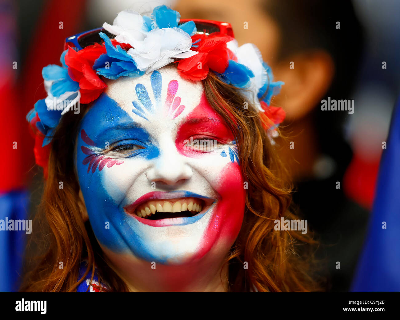 Paris, France. 3rd July, 2016. Fans and spectators with colorful face ...