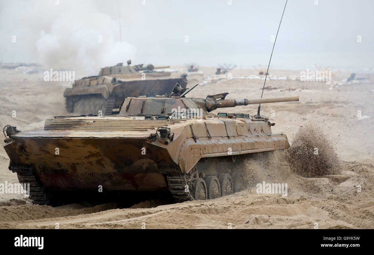 Ustka, Poland. 16th June, 2016. Polish tanks pace across a stretch of ...
