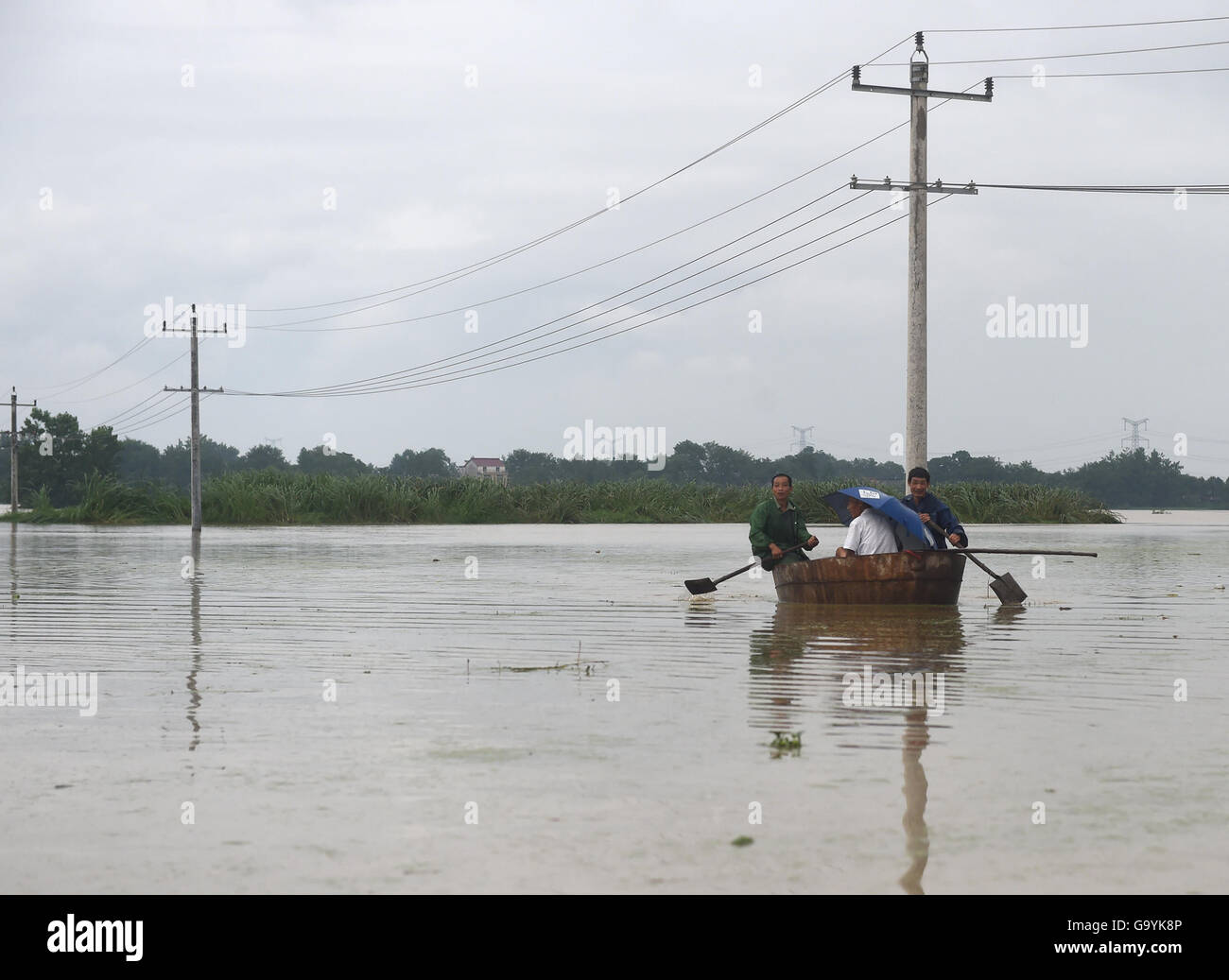 Tongcheng, China's Anhui Province. 4th July, 2016. Local villagers row ...
