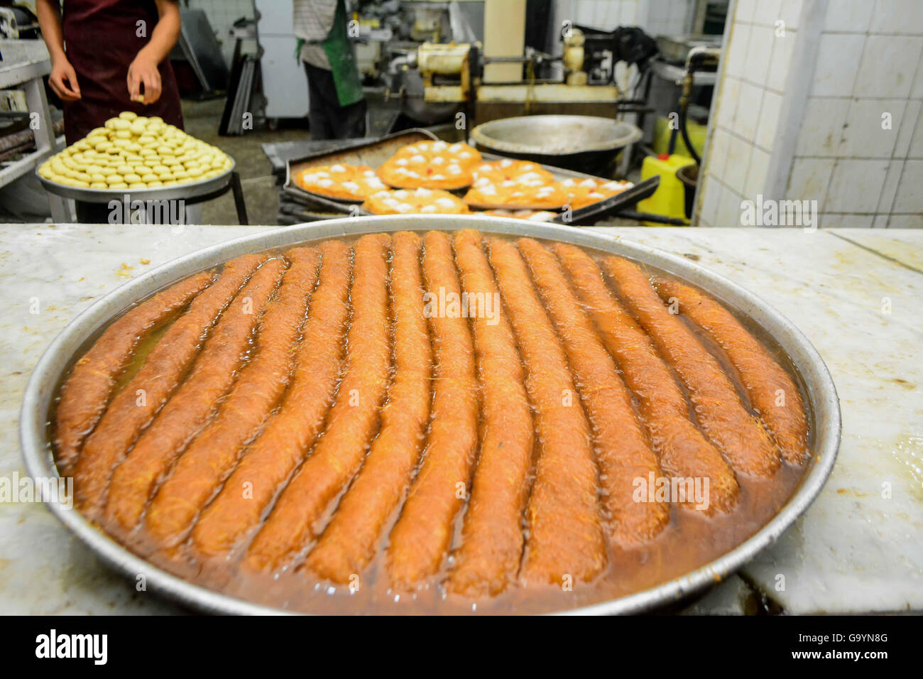 Cairo, Egypt. 16th July, 2015. Egyptian bakers prepare date-filled mini ...