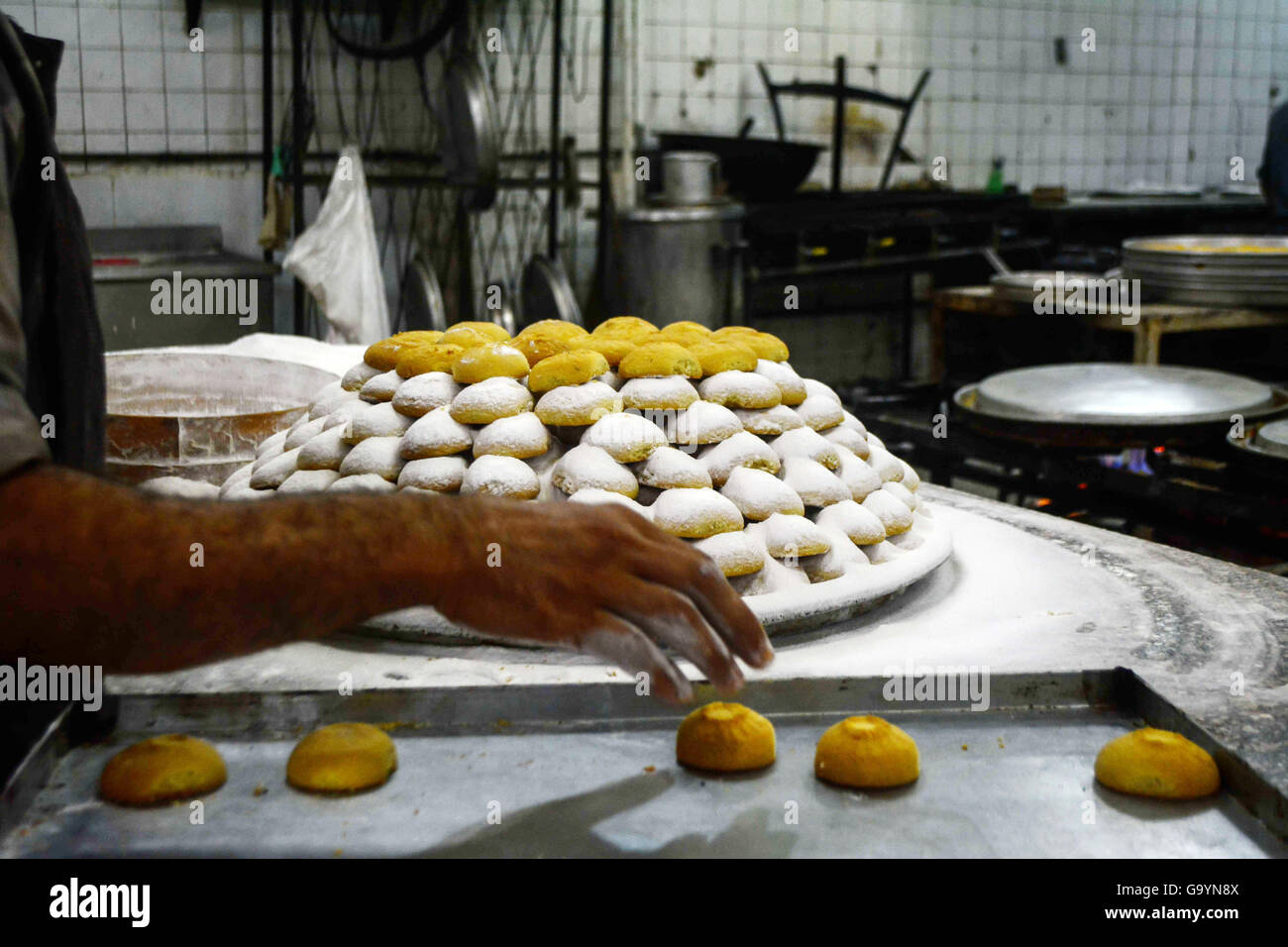 Cairo, Egypt. 16th July, 2015. Egyptian bakers prepare date-filled mini ...