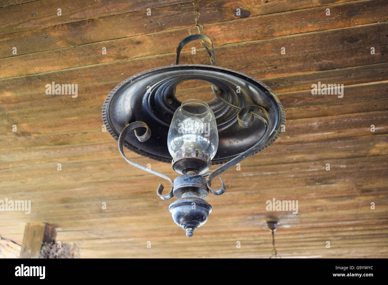 Ceiling lamp on the wooden ceiling. The frame light bulb Stock Photo ...