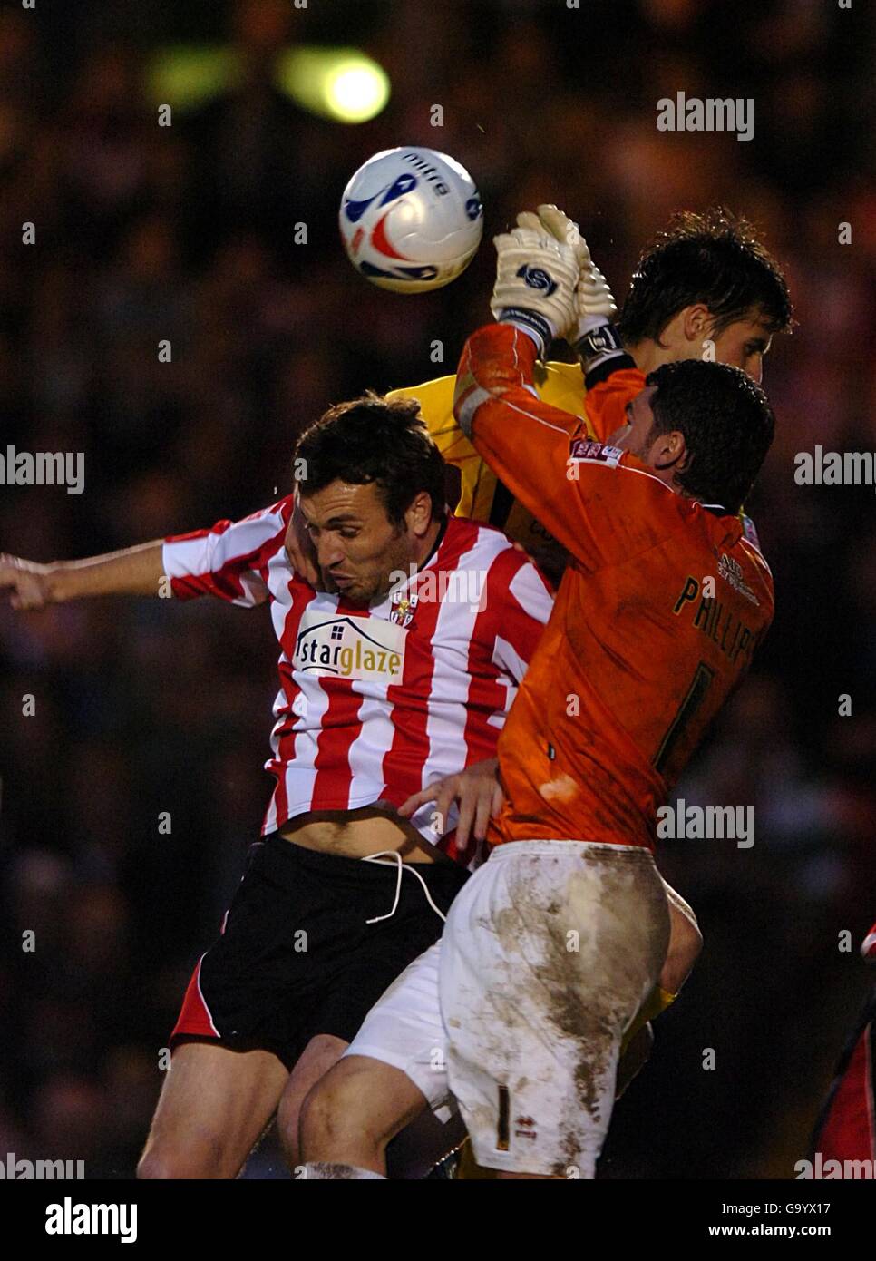 Bristol Rovers goalkeeper Steve Phillips and Lincoln City's Martin ...