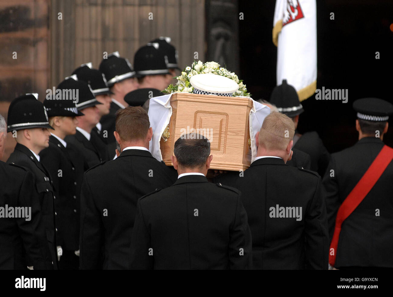 The coffin of PC Ricky Gray is carried into Shrewsbury Abbey ...