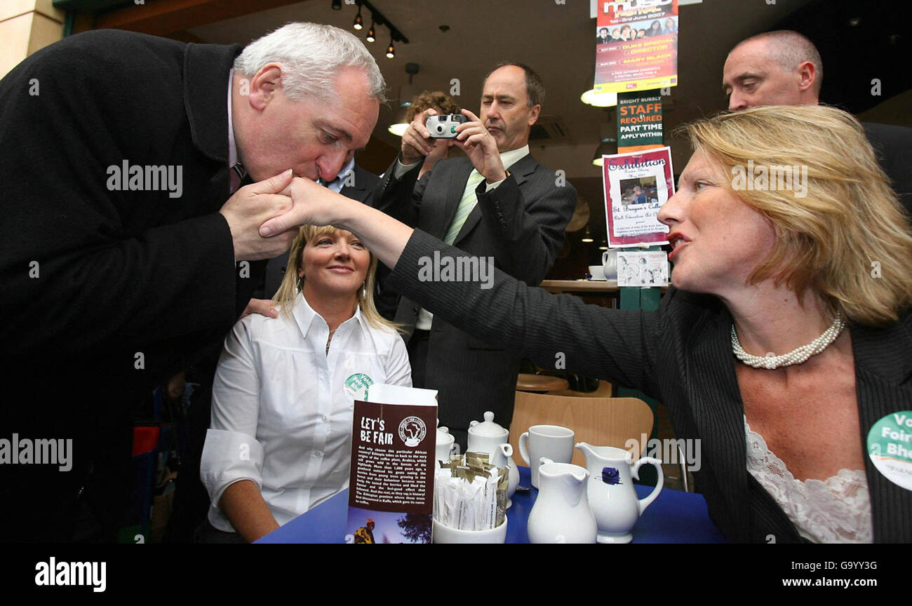 Taoiseach Bertie Ahern kisses the hand of Election worker Carmel Murphy ...