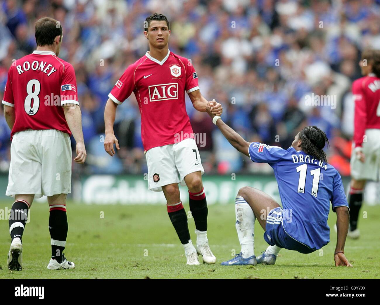 Manchester uniteds cristiano ronaldo gives chelseas didier drogba a ...