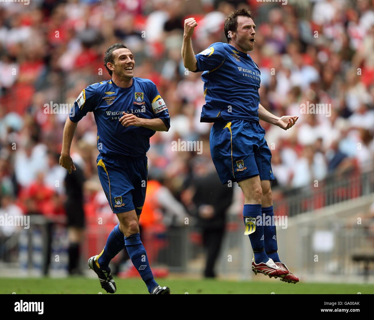 Morecambe's Garry Thompson (right) celebrates scoring the second goal ...