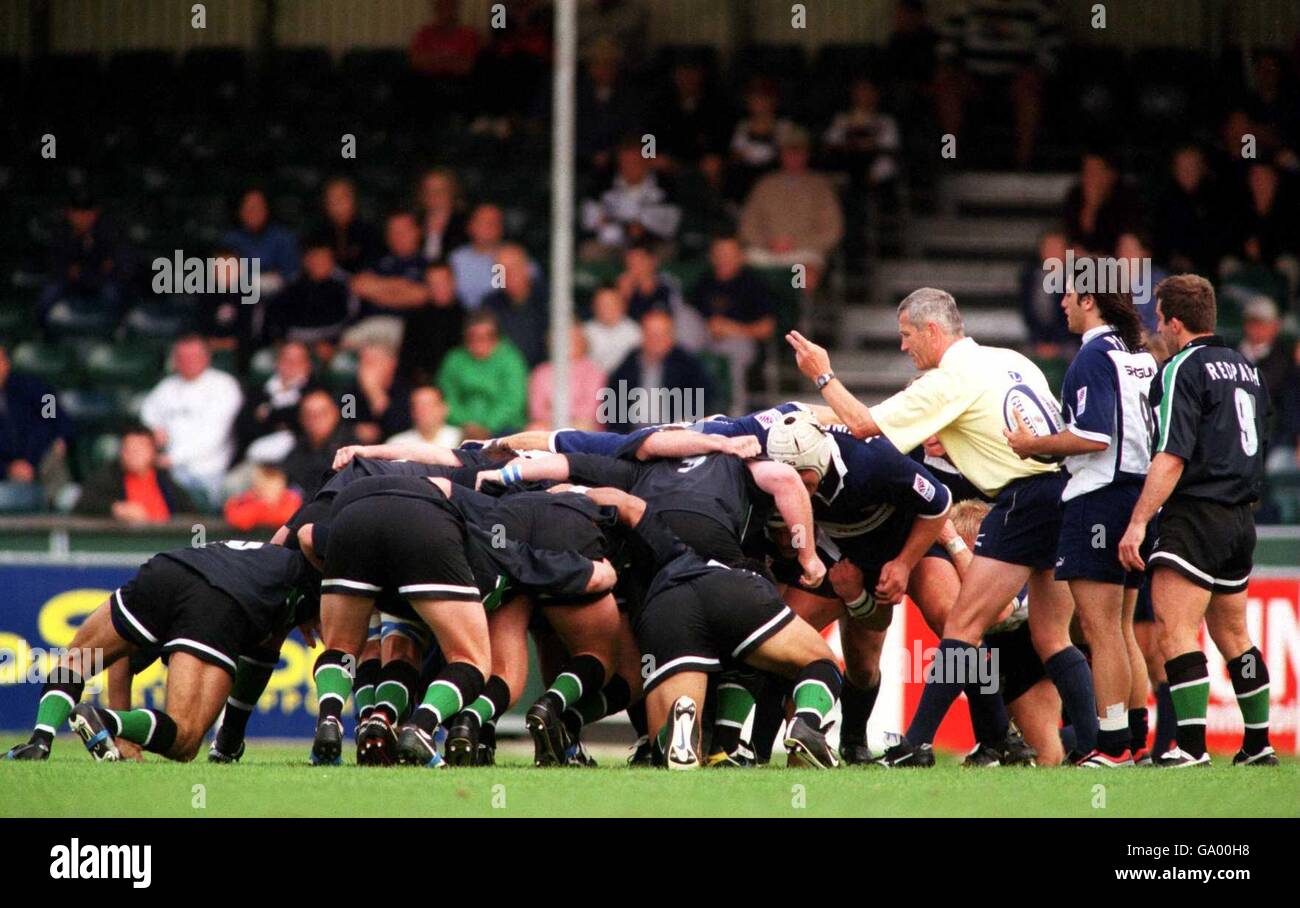 Referee Robin Goodliffe (third r) brings the two packs together as the ...