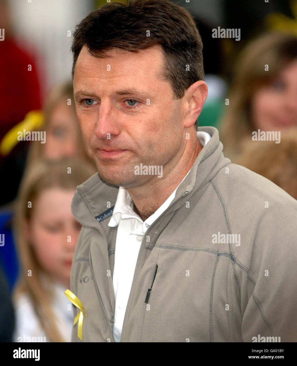 Gerry McCann looks at messages of support at a yellow ribbon festooned ...