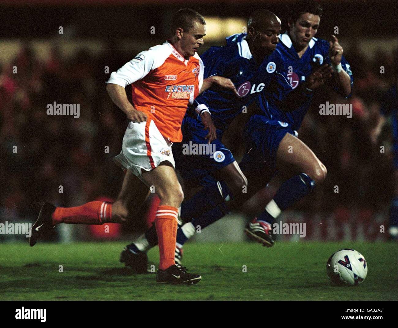 Blackpool's Martin Bullock breaks upfield closely followed by the ...