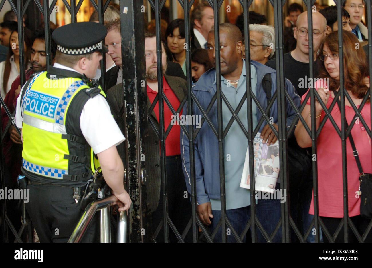 Lineside fire causes rail and road chaos. London commuters wait at ...