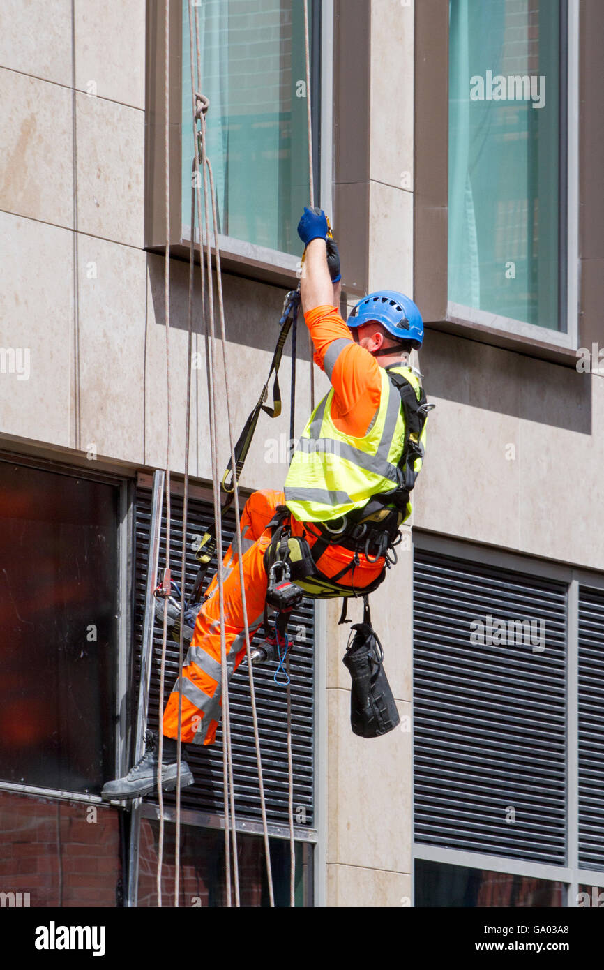 Man working at height with health & rope safety apparatus ppe Stock ...