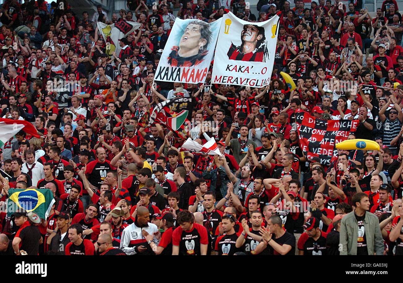 Ac milan fans cheer on their team in the stands hi-res stock ...