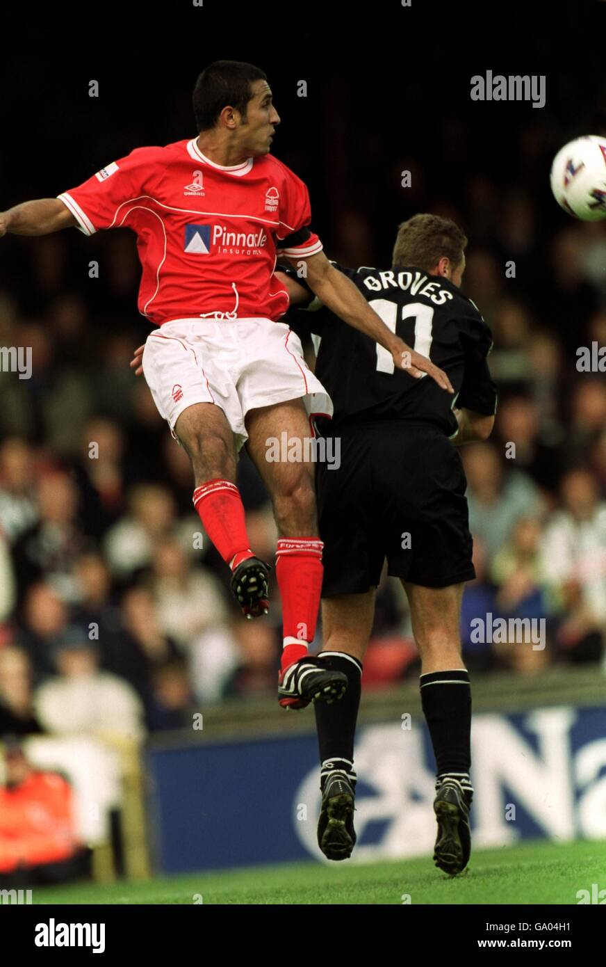 Nottingham Forest's Jack Lester gets above Grimsby Town's Paul Groves ...