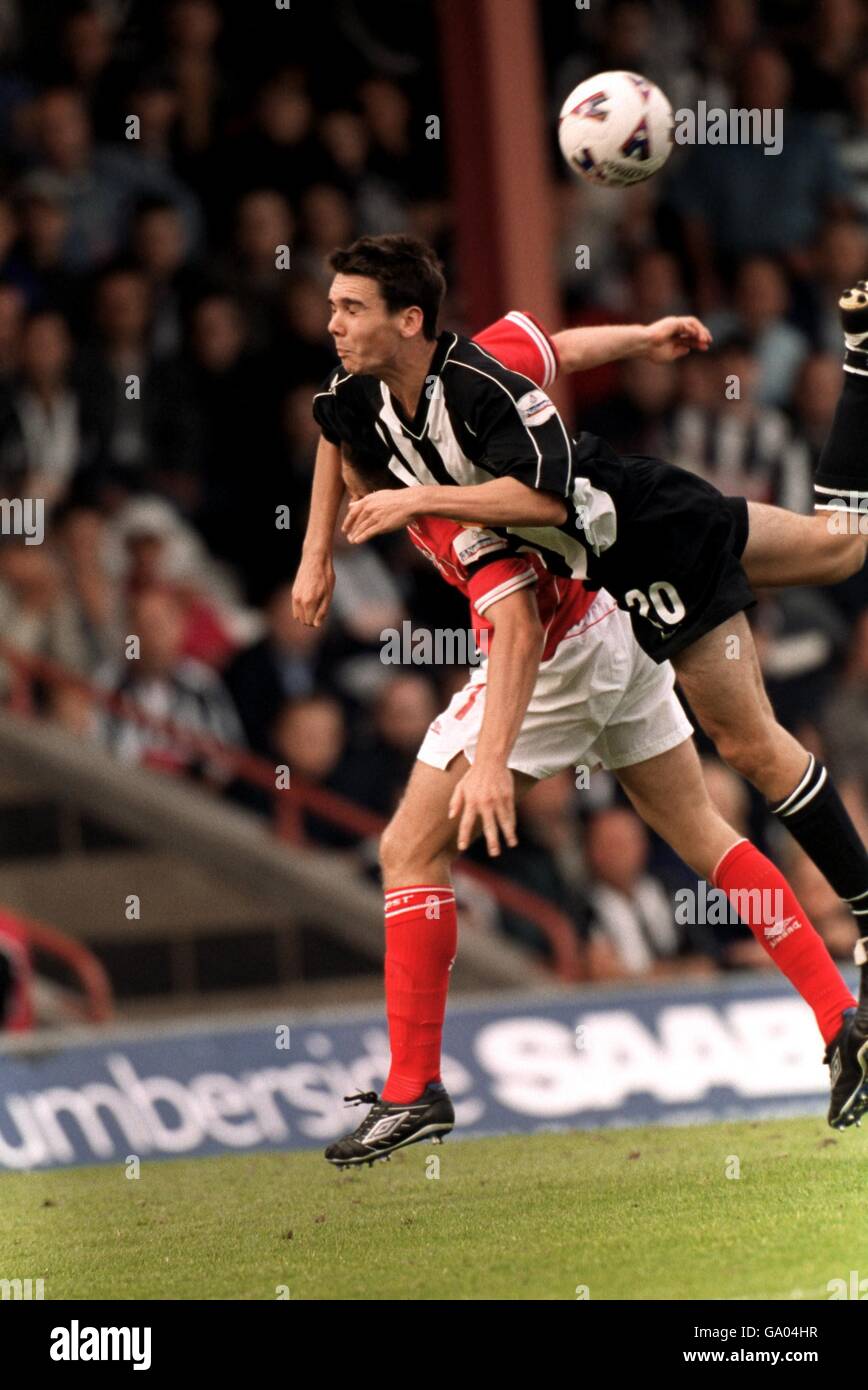Grimsby Town's Jonathon Rowan beats Nottingham Forest's Chris Doig to ...
