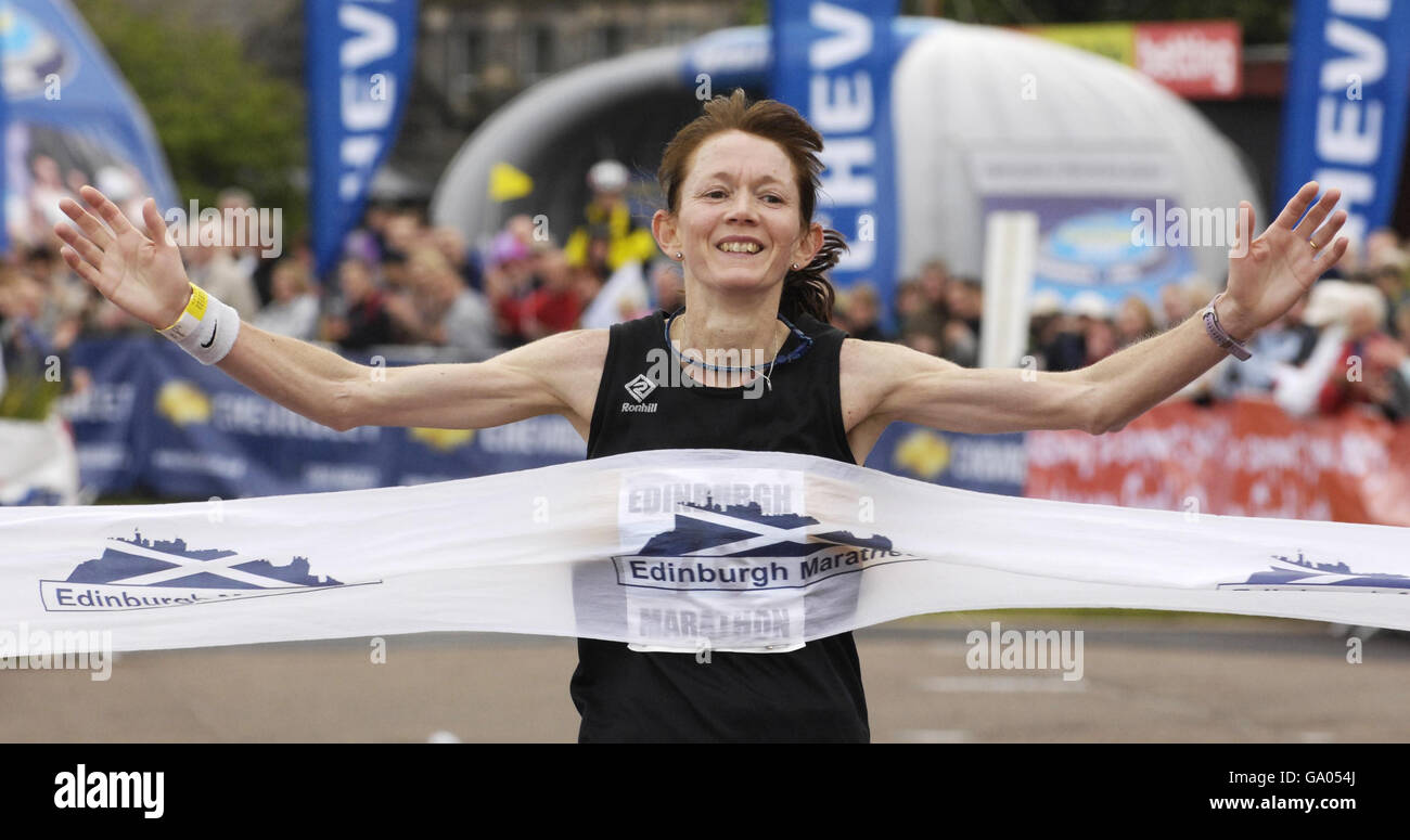Winning female Fiona Matheson crosses the Edinburgh Marathon finish ...