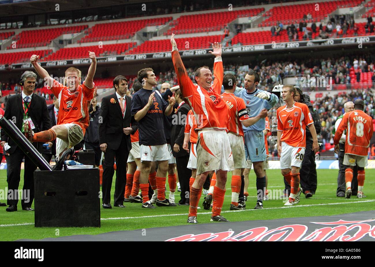 Blackpools andrew morrell centre leads the celebrations after the game ...