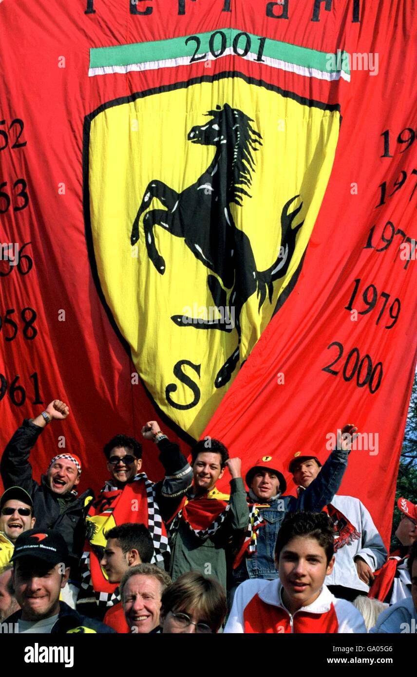 Ferrari fans stand infront of a huge banner hi-res stock photography ...
