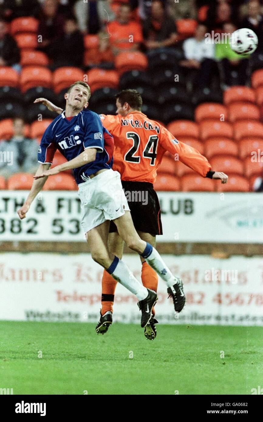 Rangers' Tore Andre Flo tries to challenge Dundee United's David ...
