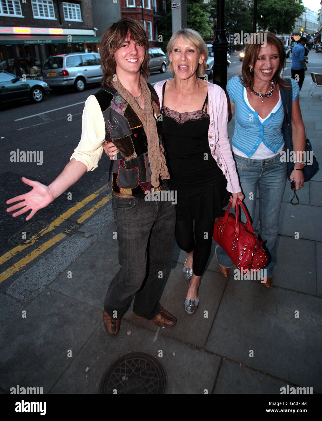 Ingrid Tarrant (centre) with lead singer Tom Hill of Purplemelon and ...