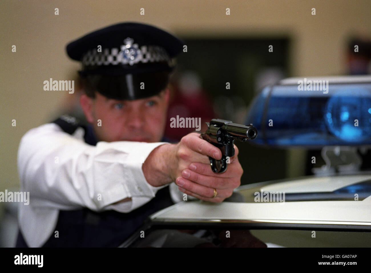 Police officers carry weapons hi-res stock photography and images - Alamy