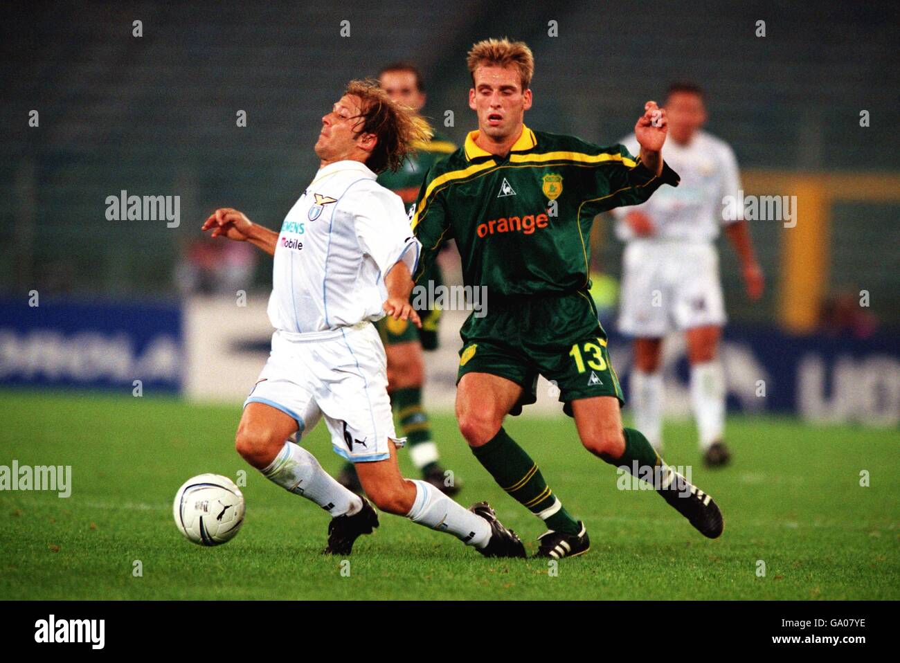 Nantes' Mathieu Berson (r) brings down Lazio's Gaizka Mendieta (l Stock ...