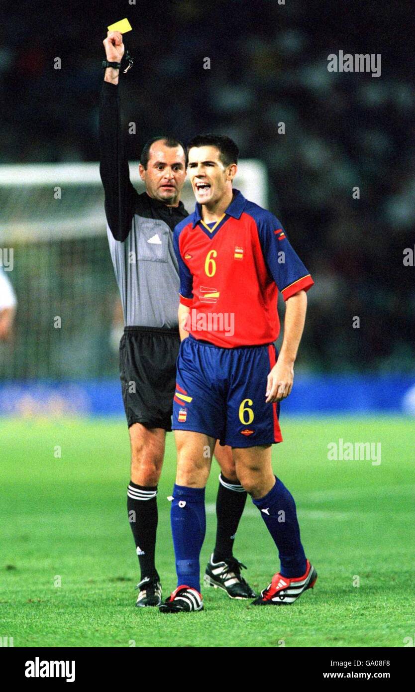 (L-R) Referee Carlos Eugenio Simon cautions Spain's David Albelda Stock ...