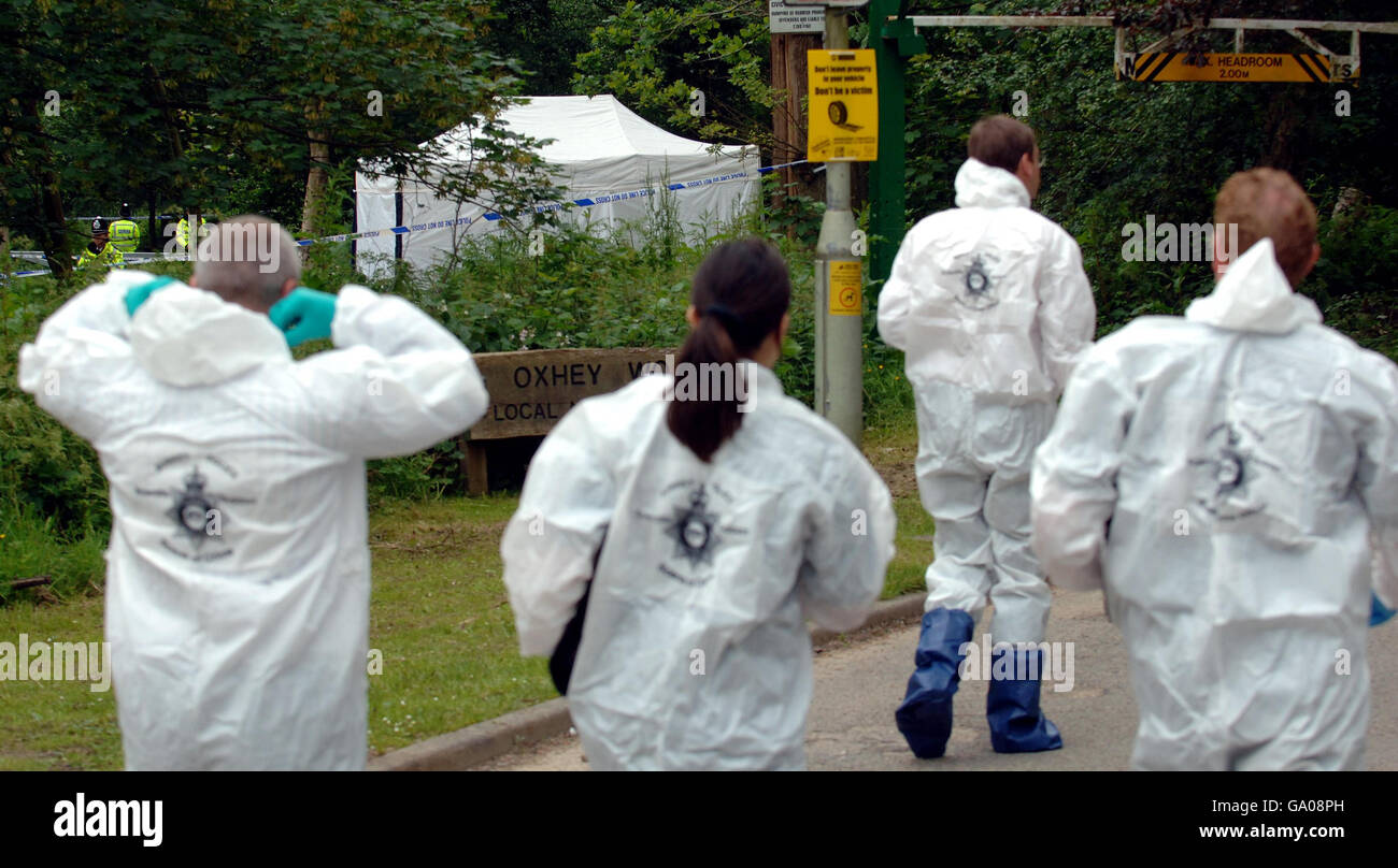 Forensic officers and a tent in oxhey woods hi-res stock photography ...