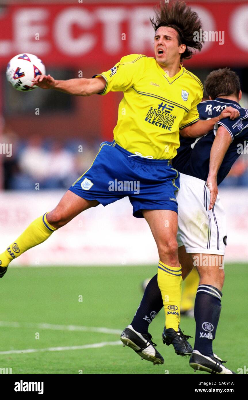 Dundee's Gavin Rae (r) is bundled out of the way by St Johnstone's Nick ...