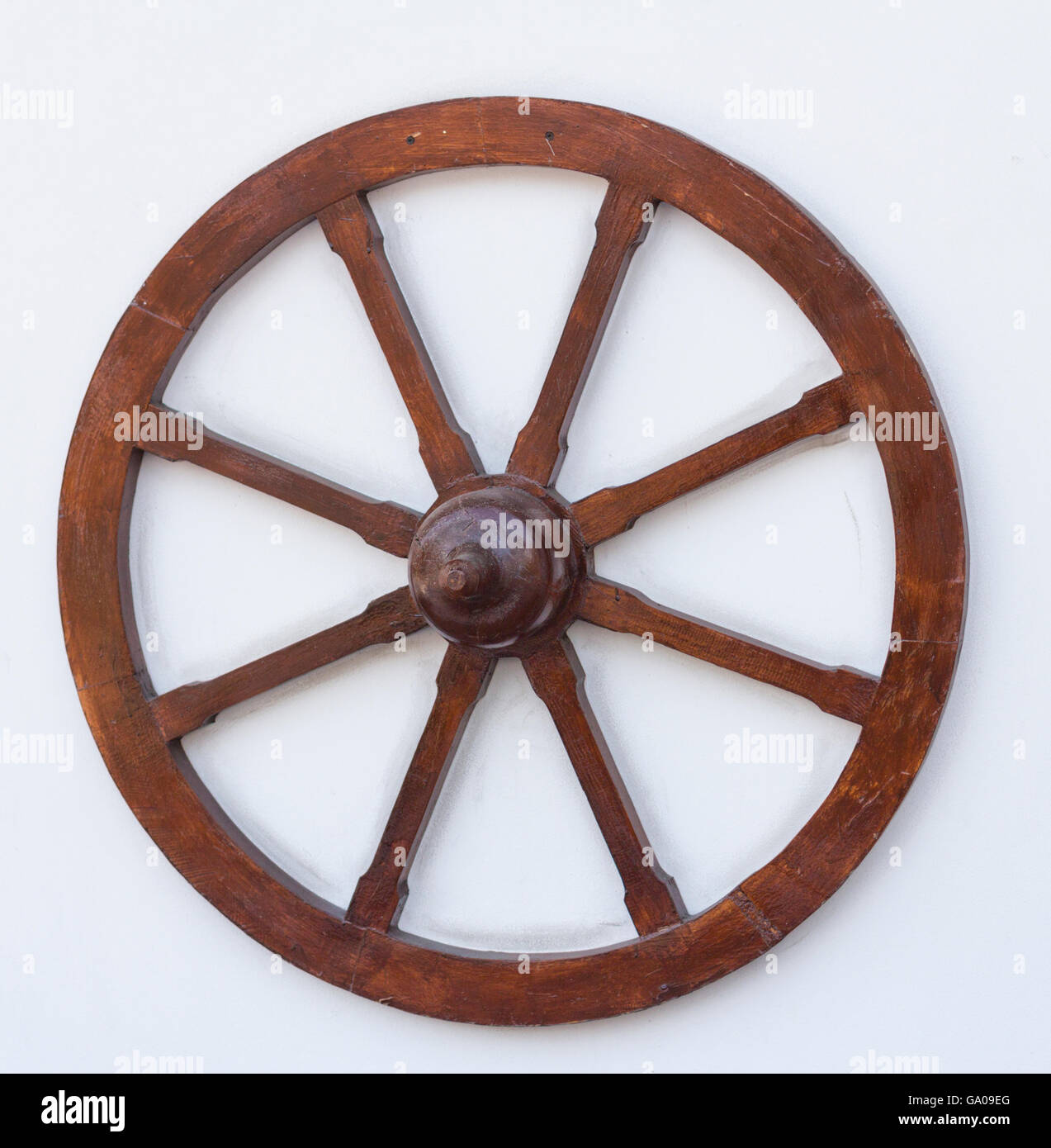 cart-wheel on wall Stock Photo - Alamy