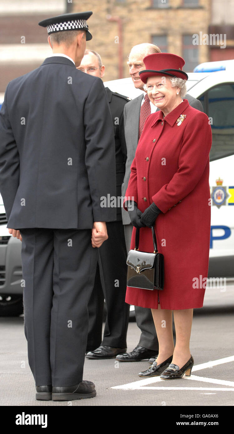 Britain's Queen Elizabeth II meets dog handler Pc Ian Worrall during a ...