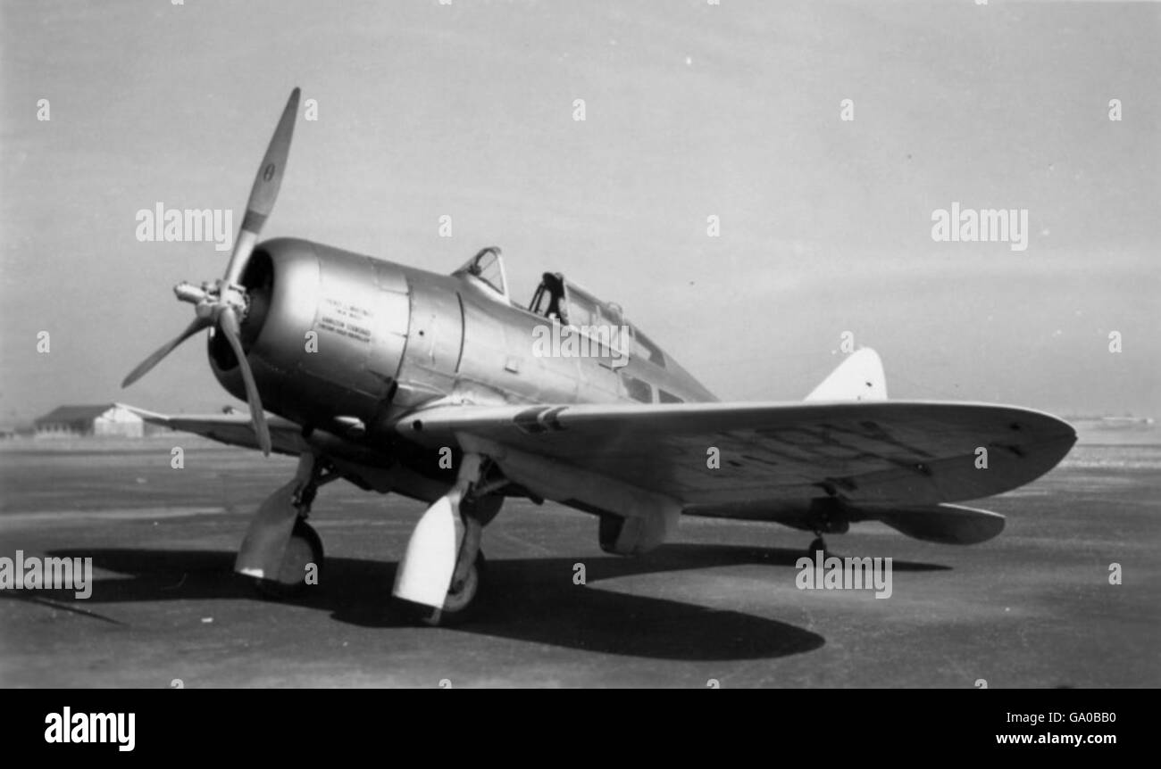 A photograph of a U.S. Navy aircraft from the 1950s in flight ...