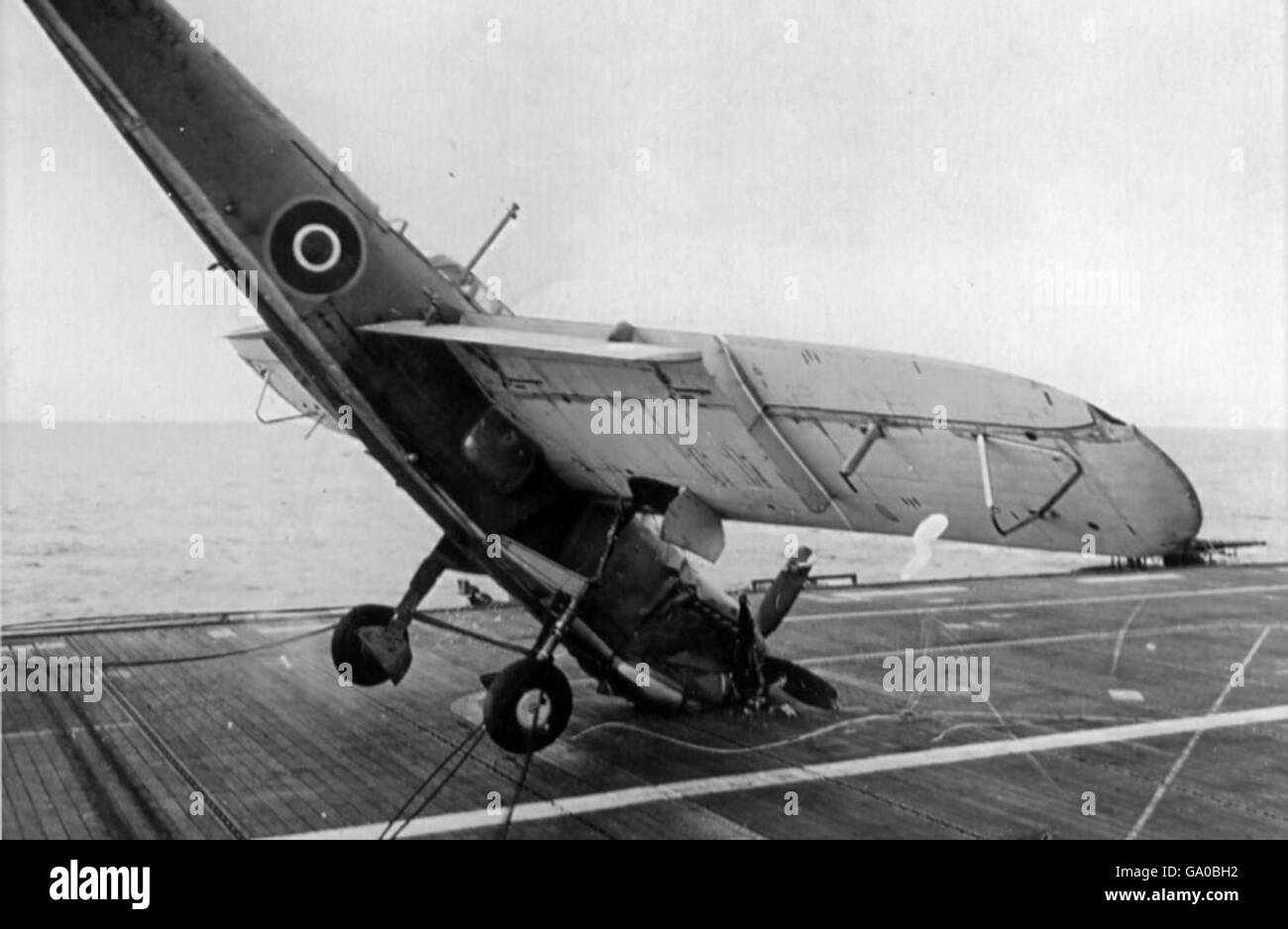A photograph of a North American P-51 Mustang, captured in flight ...