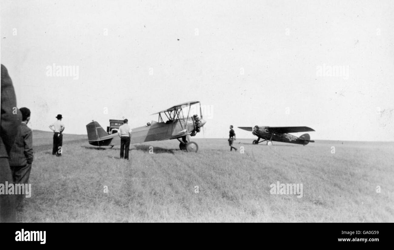 A photograph of a World War II aircraft in flight, captured during ...