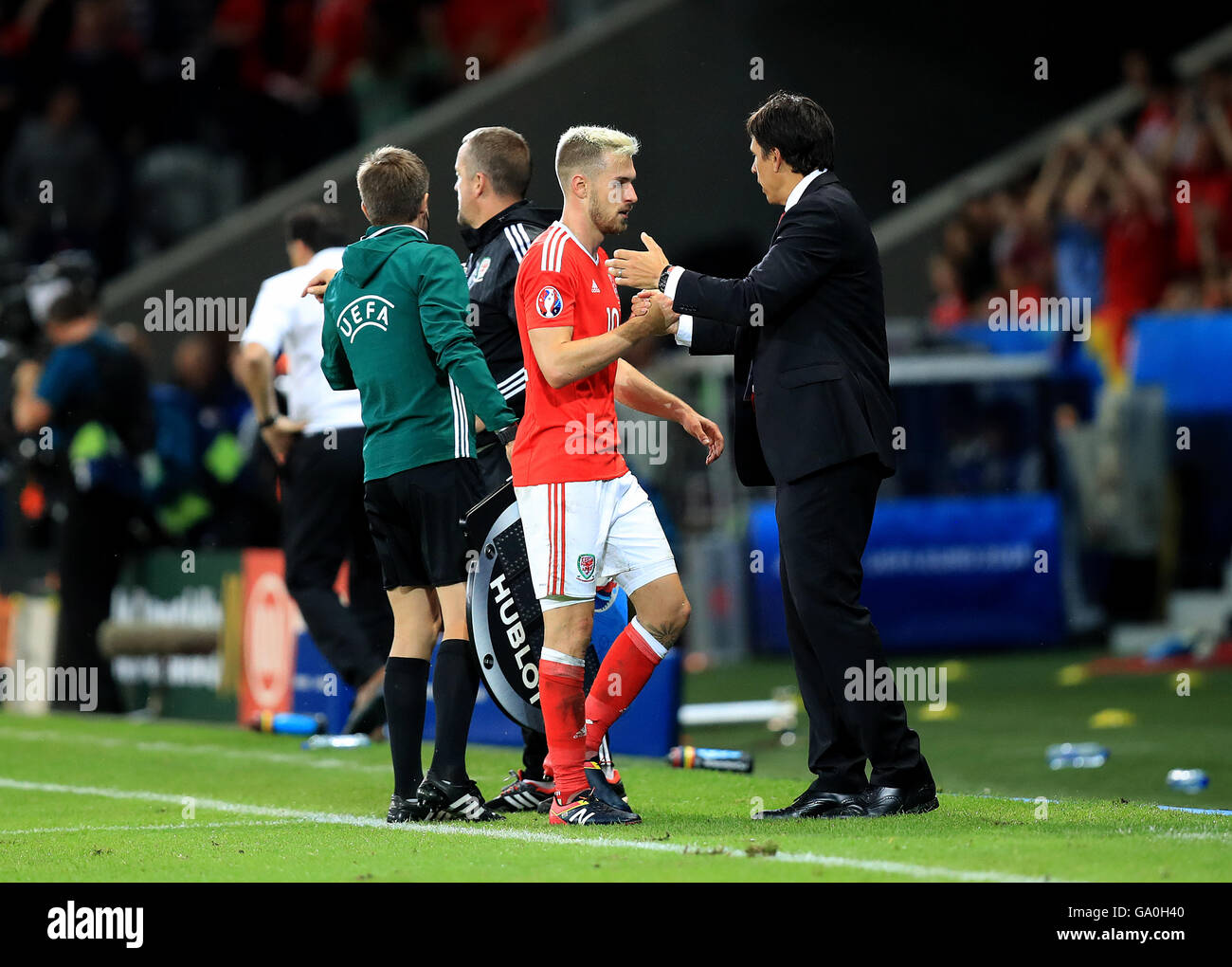 Wales' Aaron Ramsey is substituted off by manager Chris Coleman (right ...