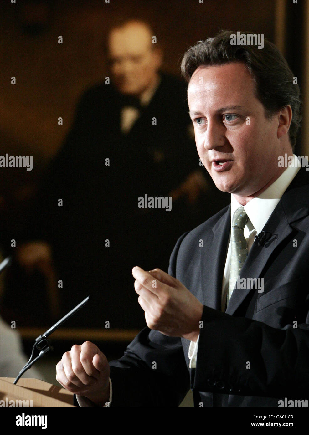 Conservative Party leader David Cameron is over looked by a Winston ...