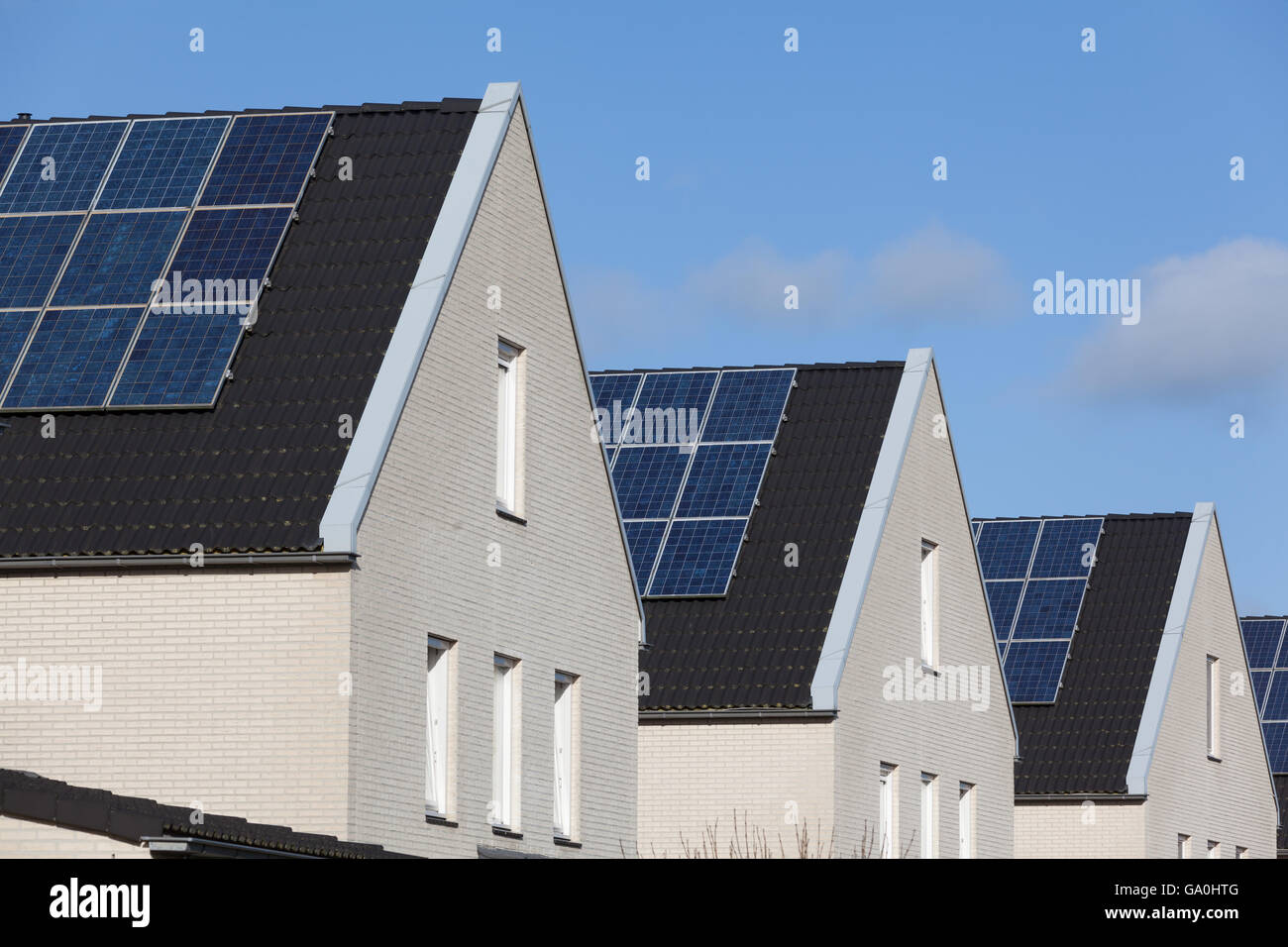 Family homes with solar panels Stock Photo - Alamy