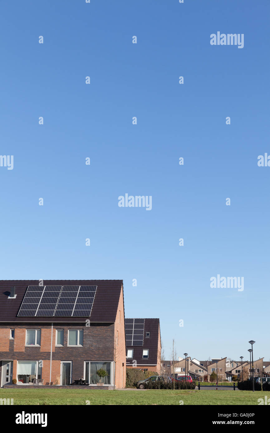 Family homes with solar panels Stock Photo - Alamy