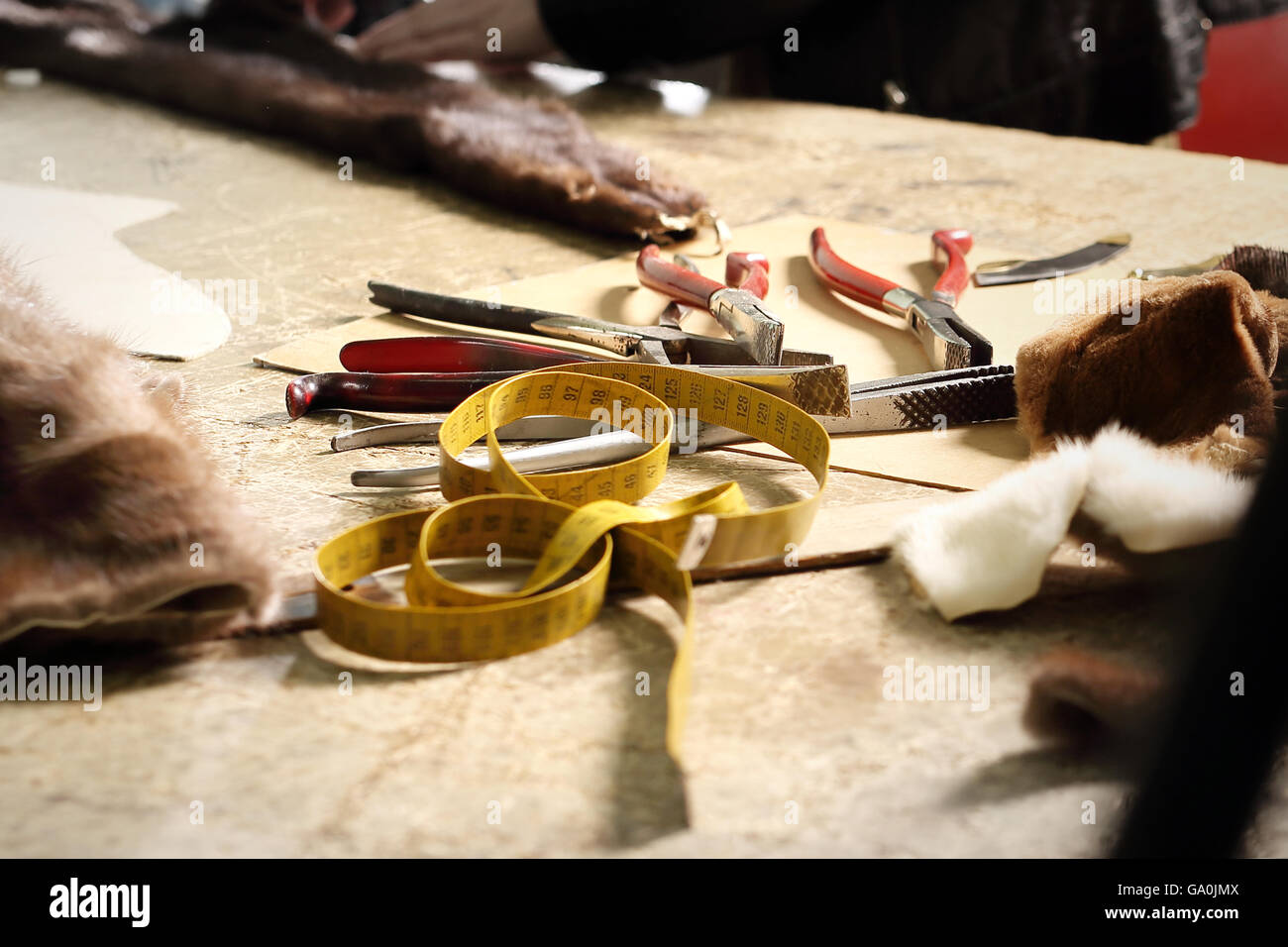 Workshop furrier, utensils, tools and pieces of natural fur Stock Photo ...