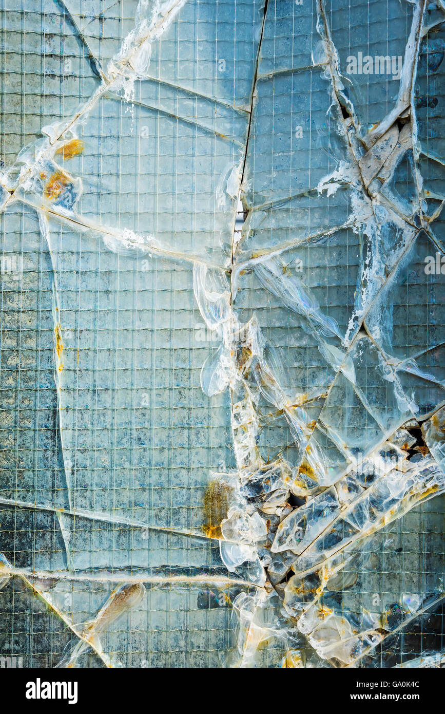 A broken industrial security window Stock Photo - Alamy