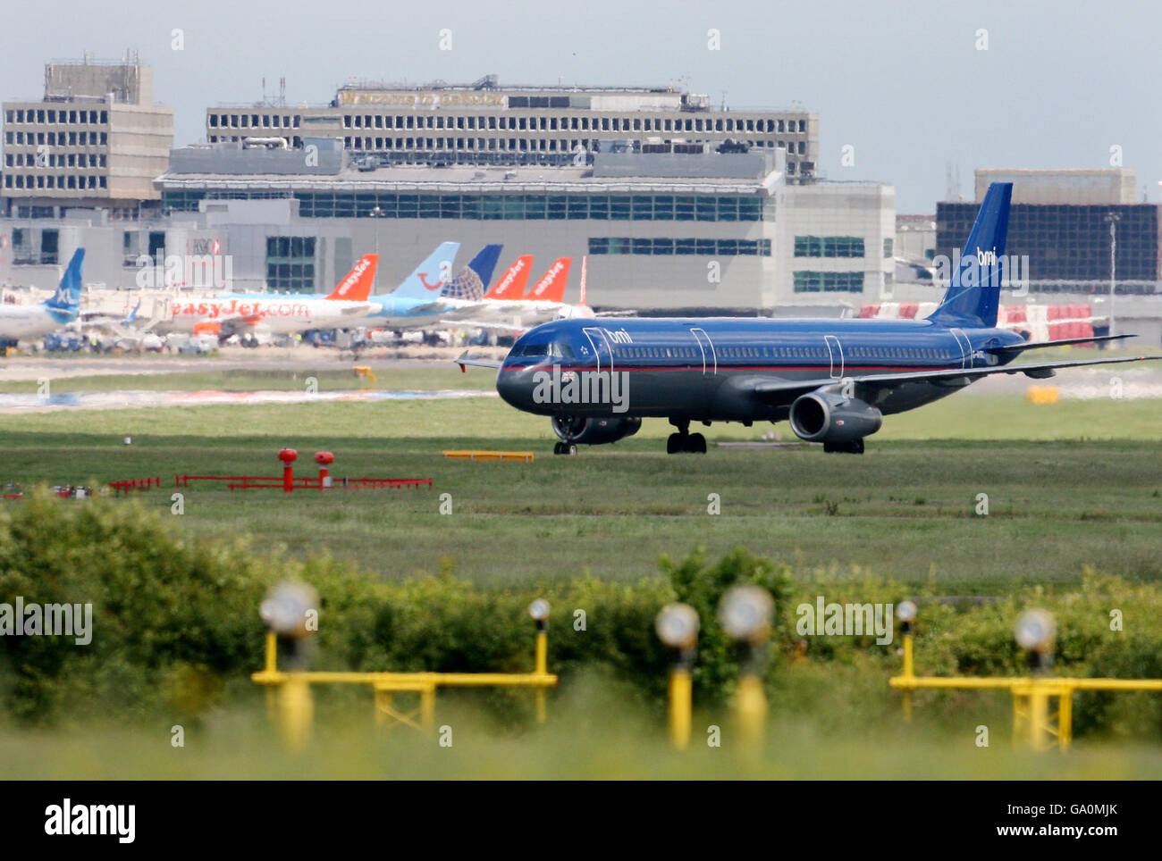 A bmi passenger plane arrives at Gatwick Airport in Sussex Stock Photo ...